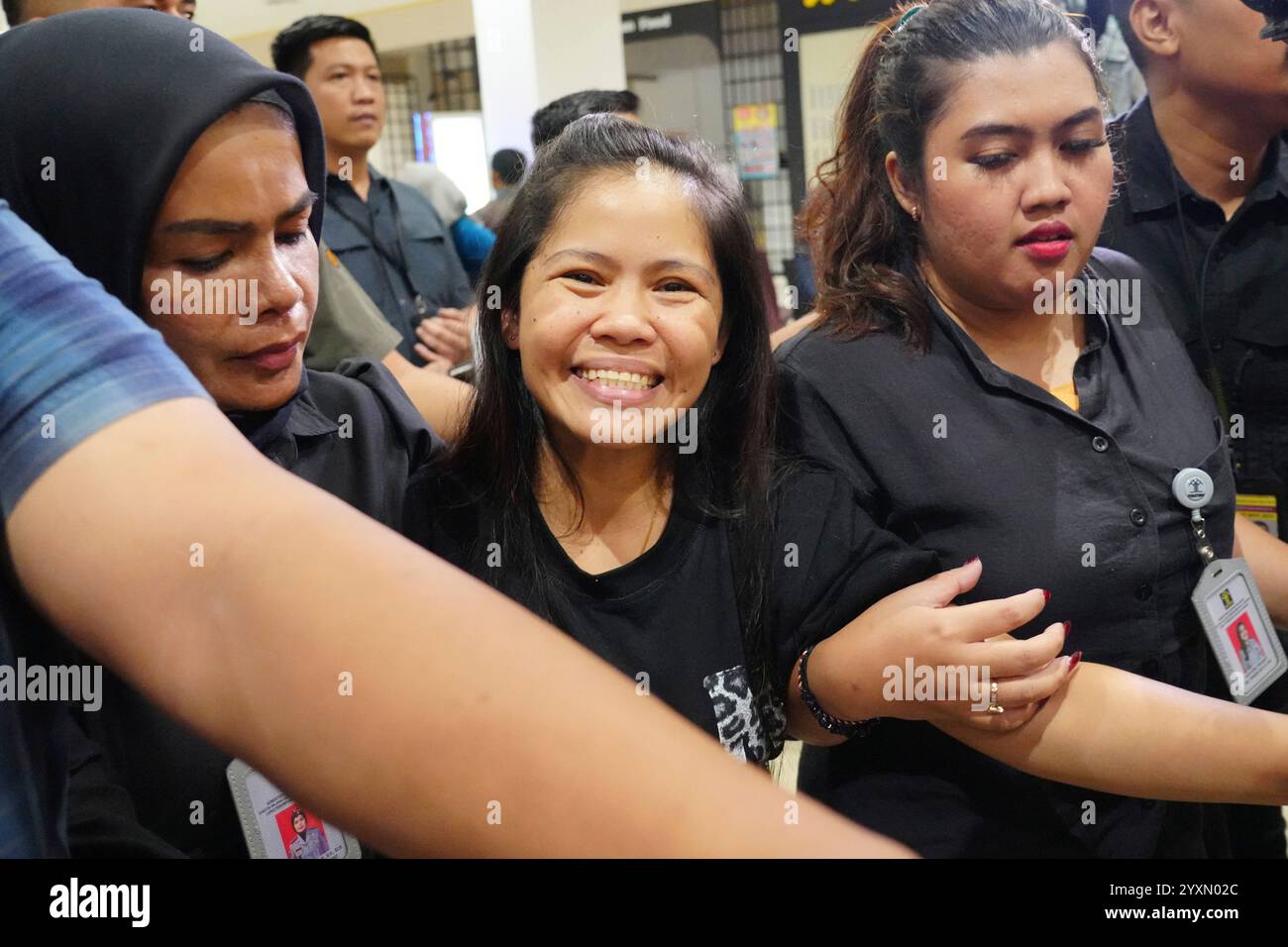 Mary Jane Veloso, center, a Filipina who was on death row in Indonesia and was nearly executed ...