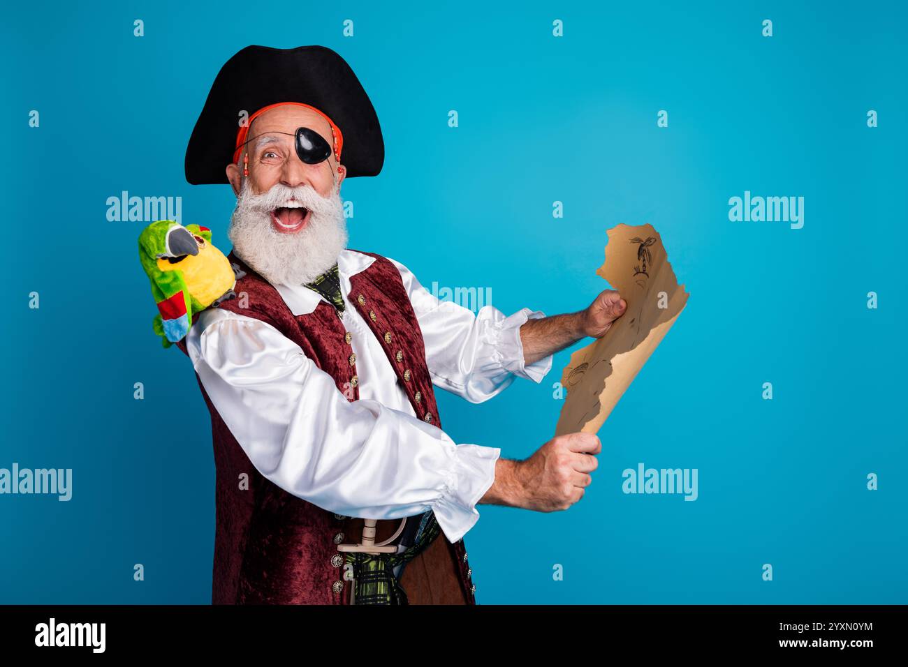 Photo portrait of old funny pirate male excited hold treasure map ...