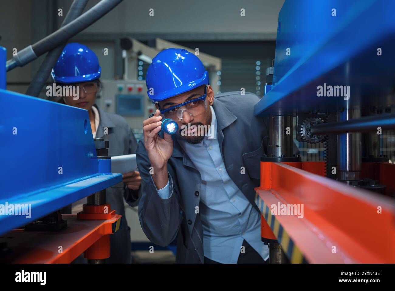 Engineers check control heavy machinery in Industrial factory for ...