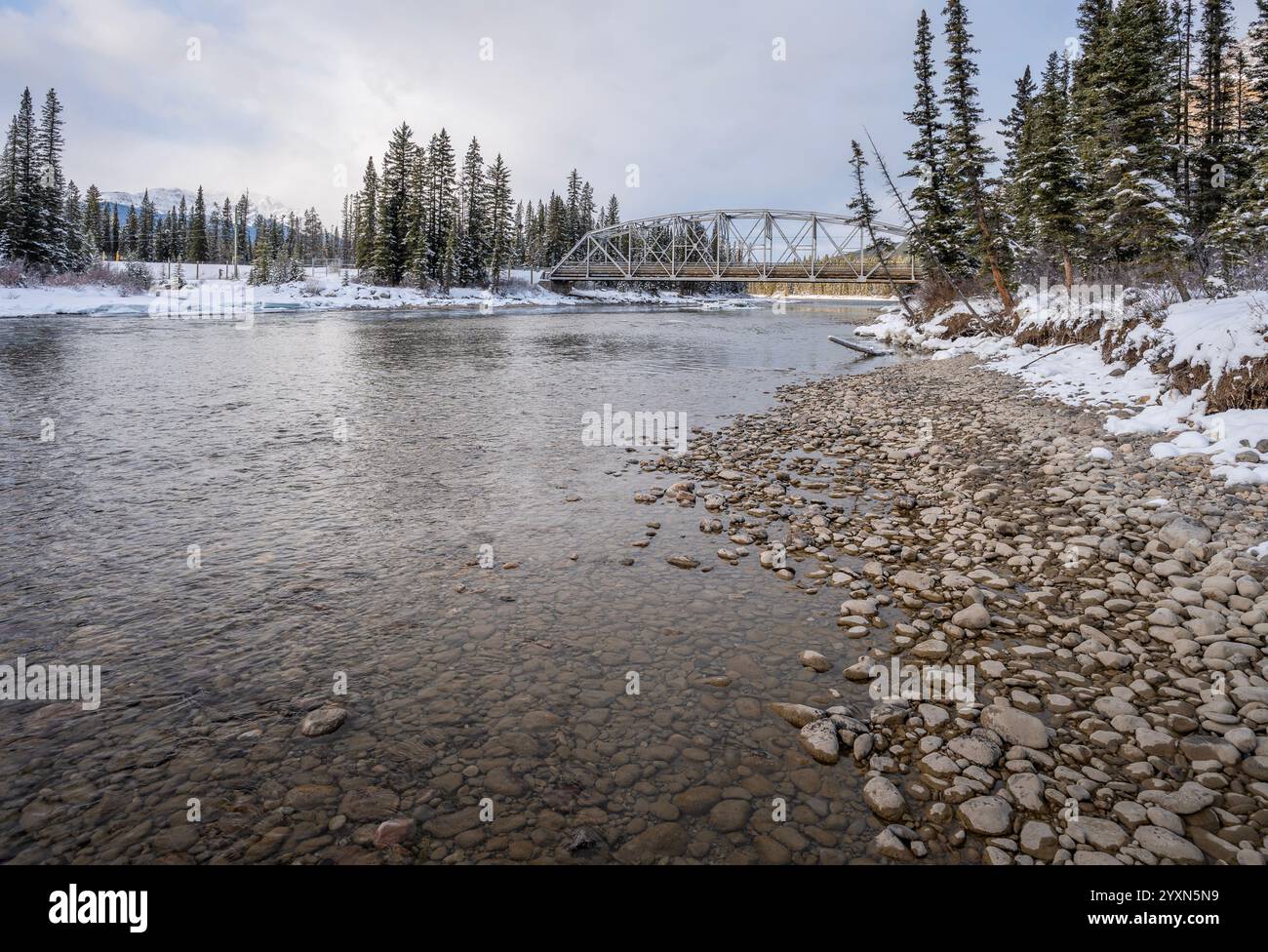 Winter view of a steel truss bridge over the Bow River at Castle ...