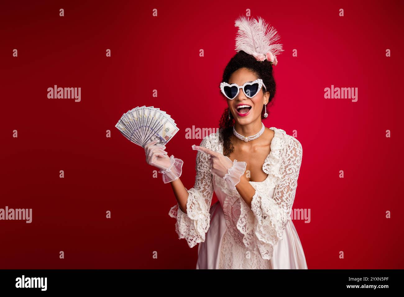 Photo of excited princess queen hold money fan pointing wear antique ...