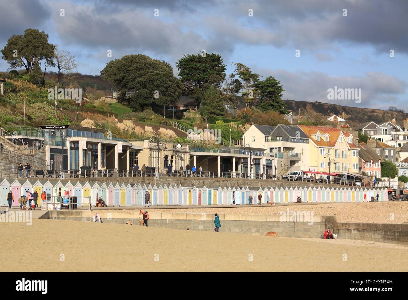 Beach with coloured beach huts at Lyme Regis Dorset England UK 2024 in ...