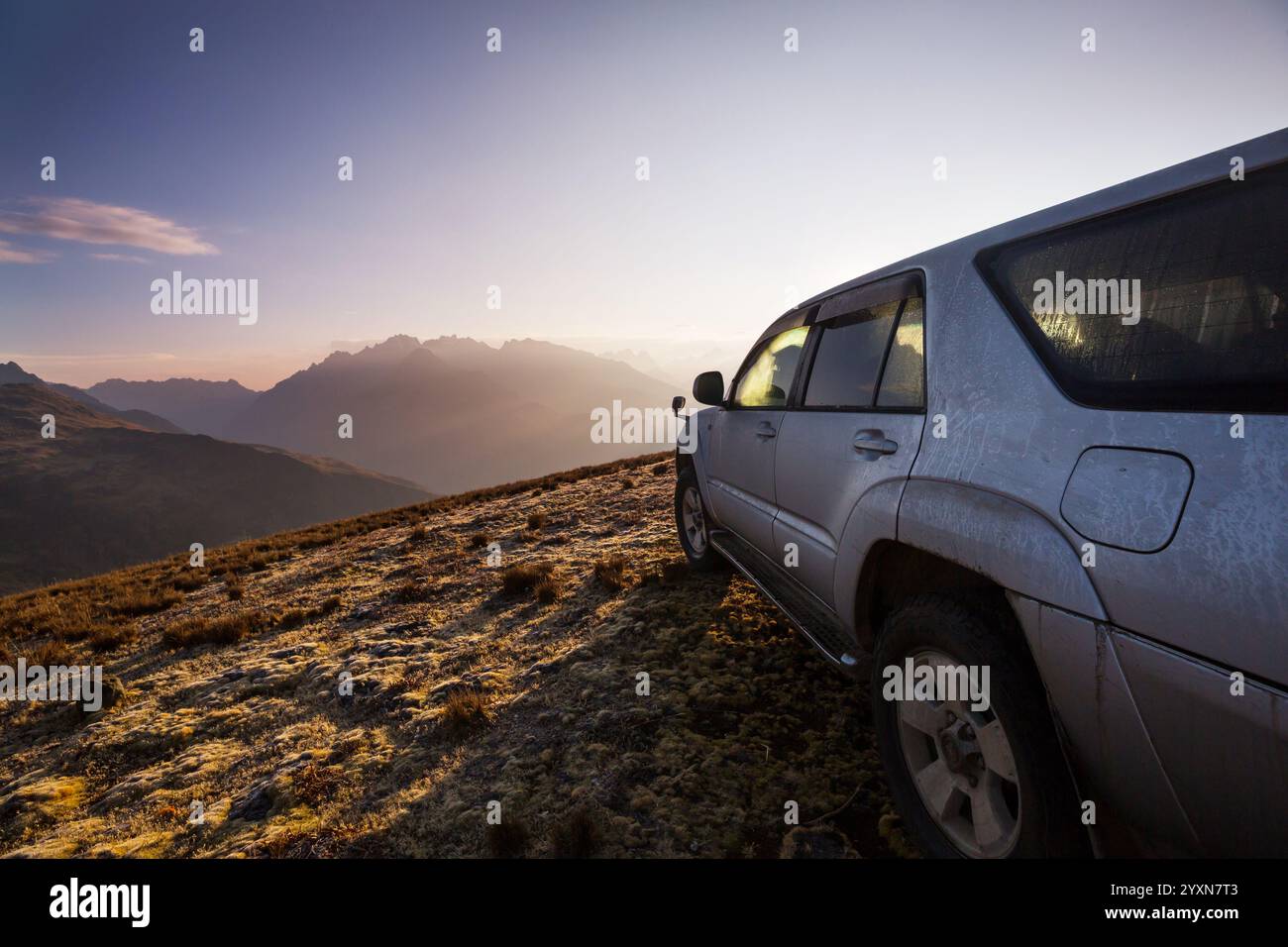 Overland car in the high mountains at sunrise Stock Photo - Alamy