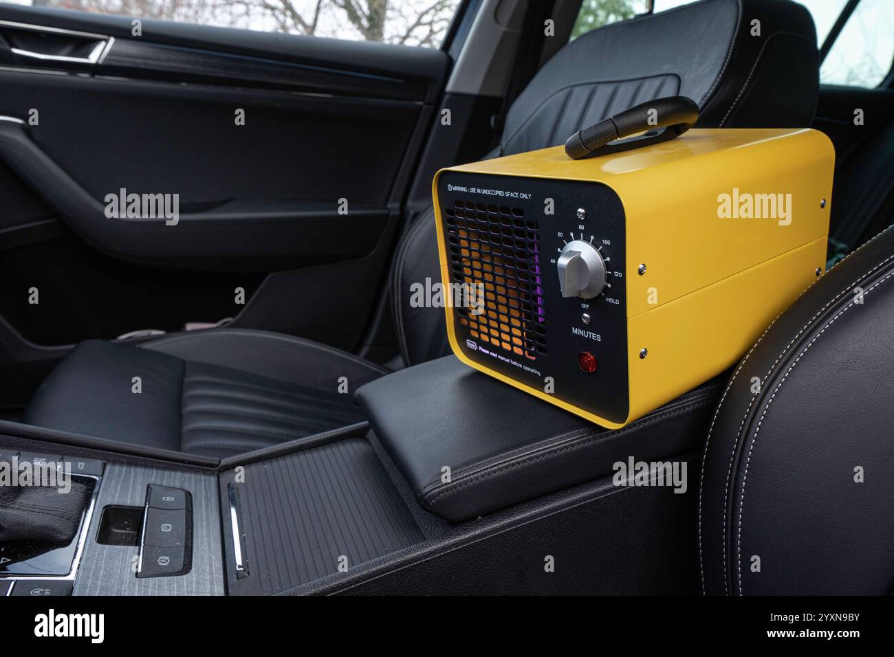 ozone generator inside a car with black leather interiour Stock Photo ...