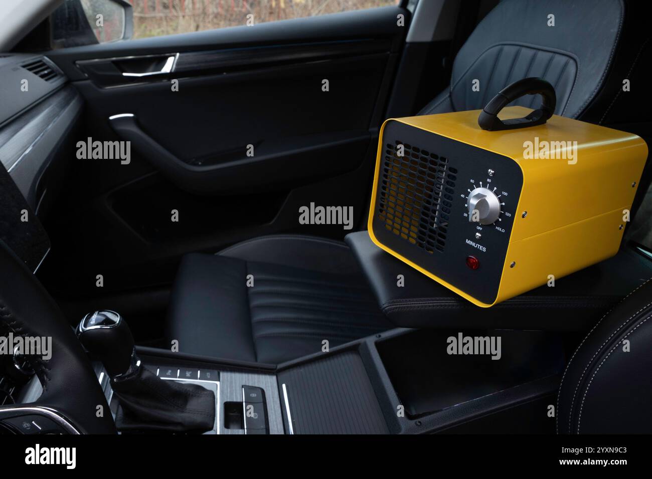 ozone generator inside a car with black leather interiour Stock Photo ...