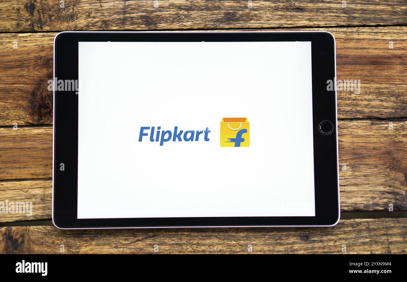 Flipkart application on smartphone with laptop background Stock Photo ...