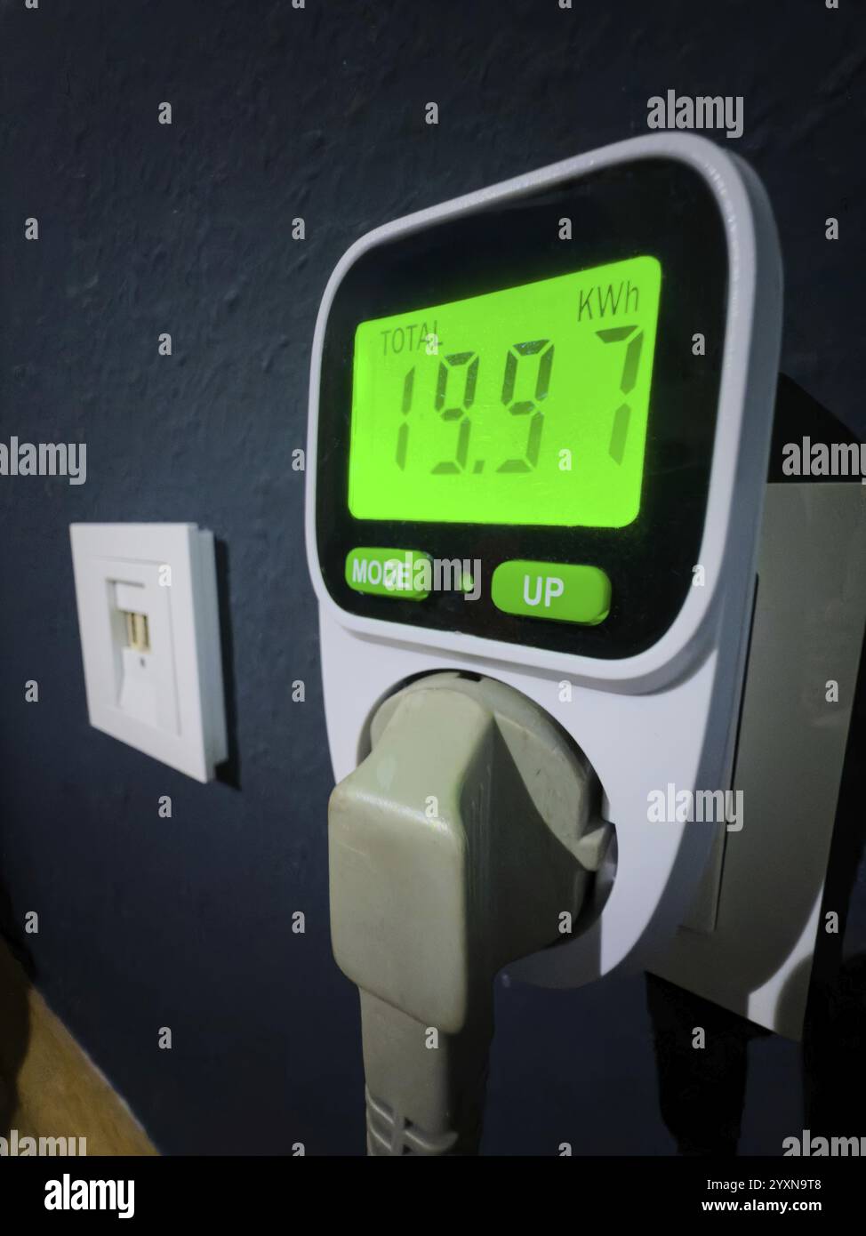 Measuring device for power consumption with display Stock Photo - Alamy