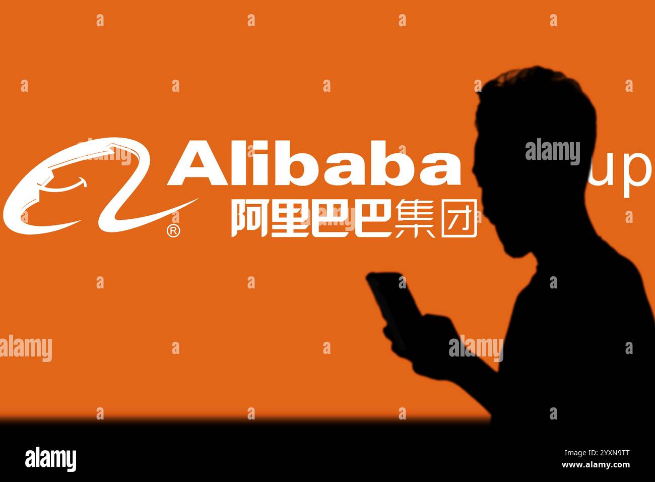 Alibaba logo on the screen smartphone. Alibaba Group Holding Limited is ...