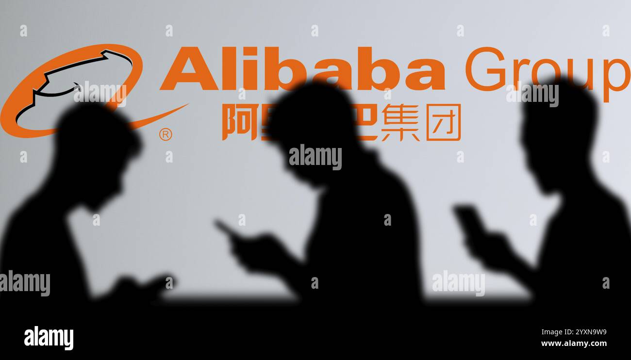 Alibaba logo on the screen smartphone. Alibaba Group Holding Limited is ...