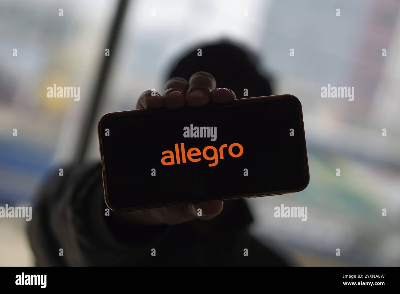 Dhaka, Bangladesh 14 Dec 2024:A close-up of a smartphone displaying the Allegro logo, an online ...