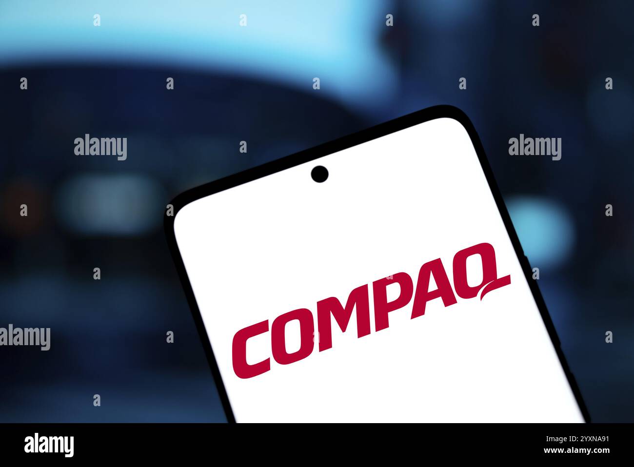 Dhaka, Bangladesh- 11 Dec 2024: COMPAQ logo is displayed on smartphone ...