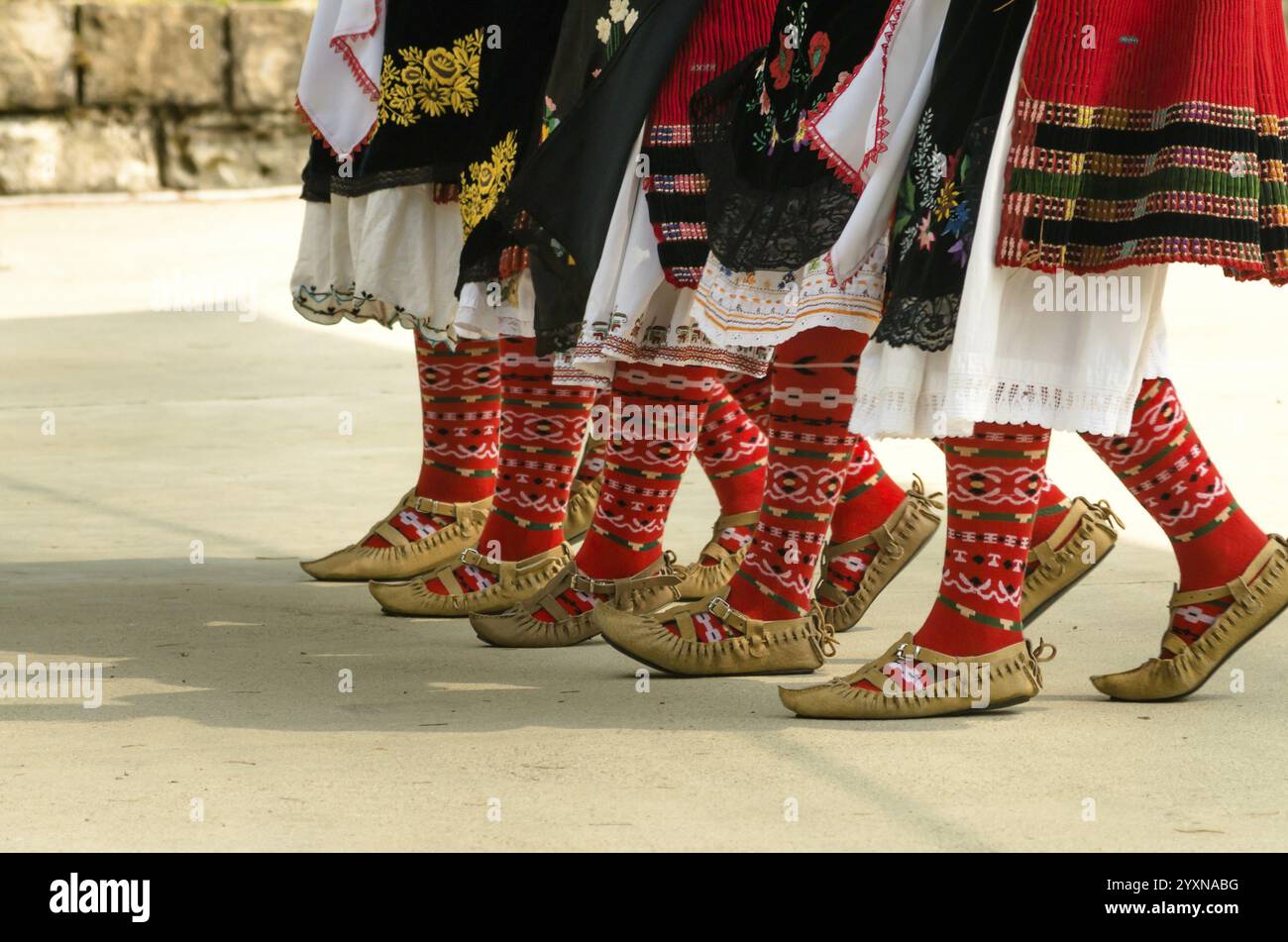 Bulgarian folklore. Girls dancing folk dance. People in traditional ...