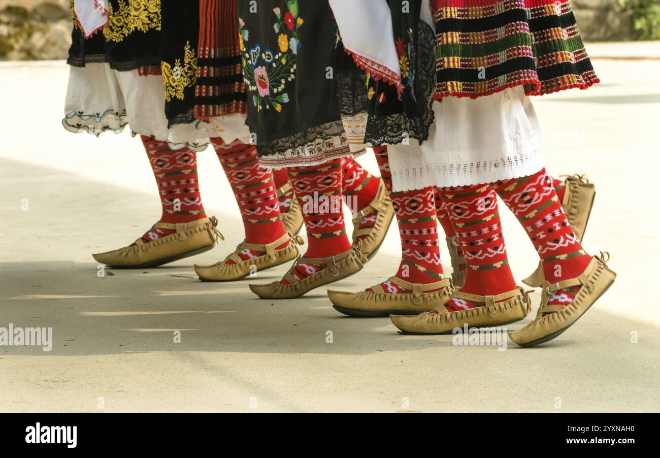 Bulgarian folklore. Girls dancing folk dance. People in traditional ...