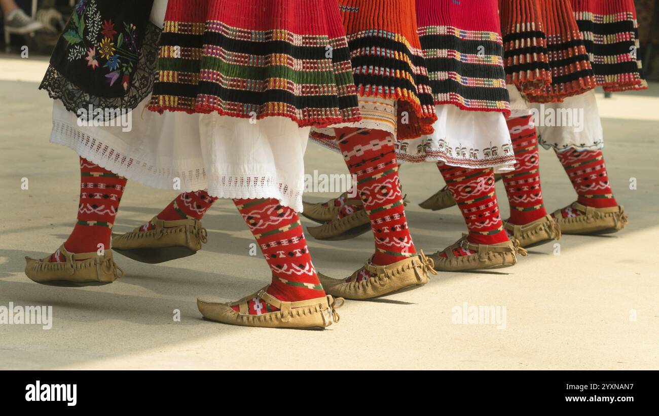 Bulgarian folklore. Girls dancing folk dance. People in traditional ...