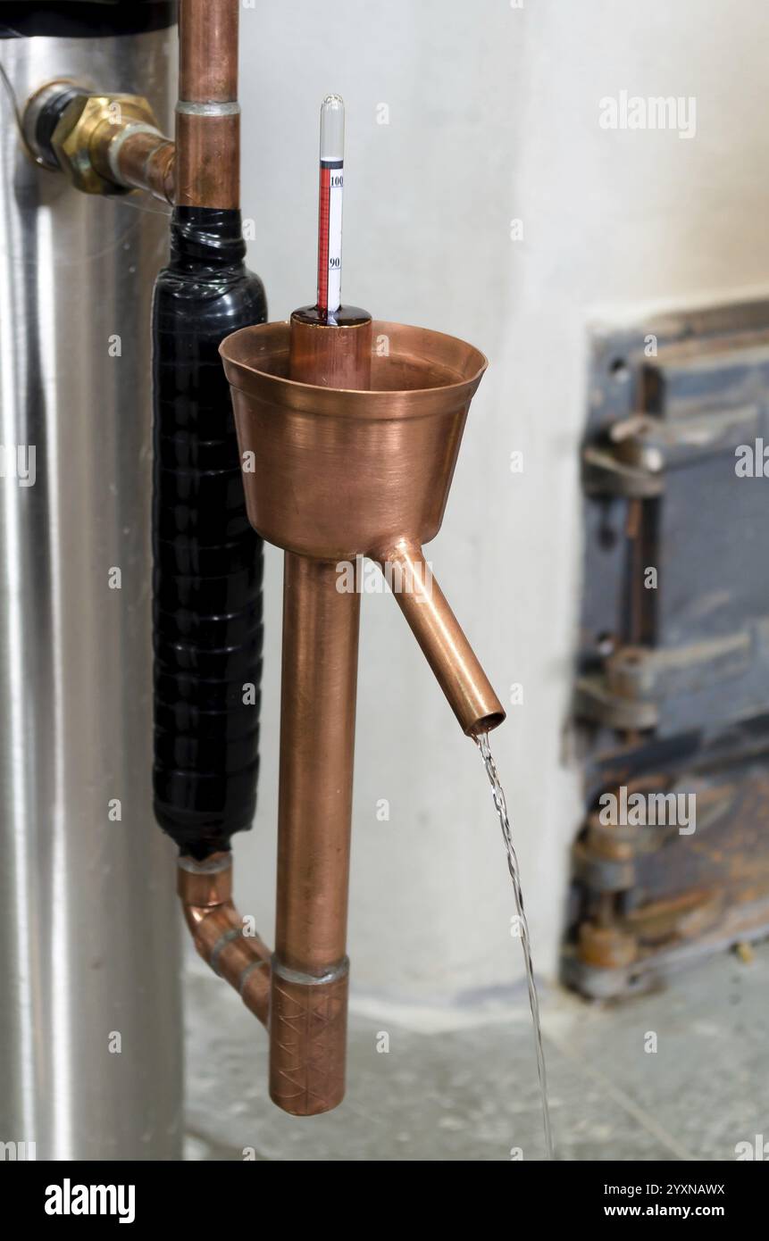 Close-up of alcohol distillation and brandy production with copper ...