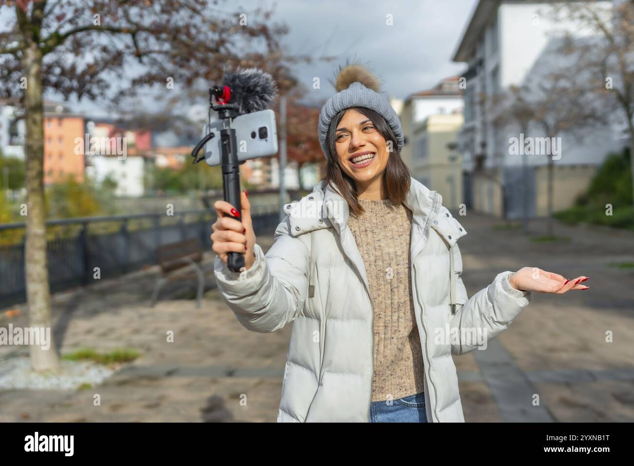 Beauty caucasian female vlogger talking to the audience recording ...