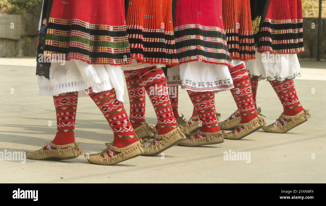 Bulgarian folklore. Girls dancing folk dance. People in traditional ...