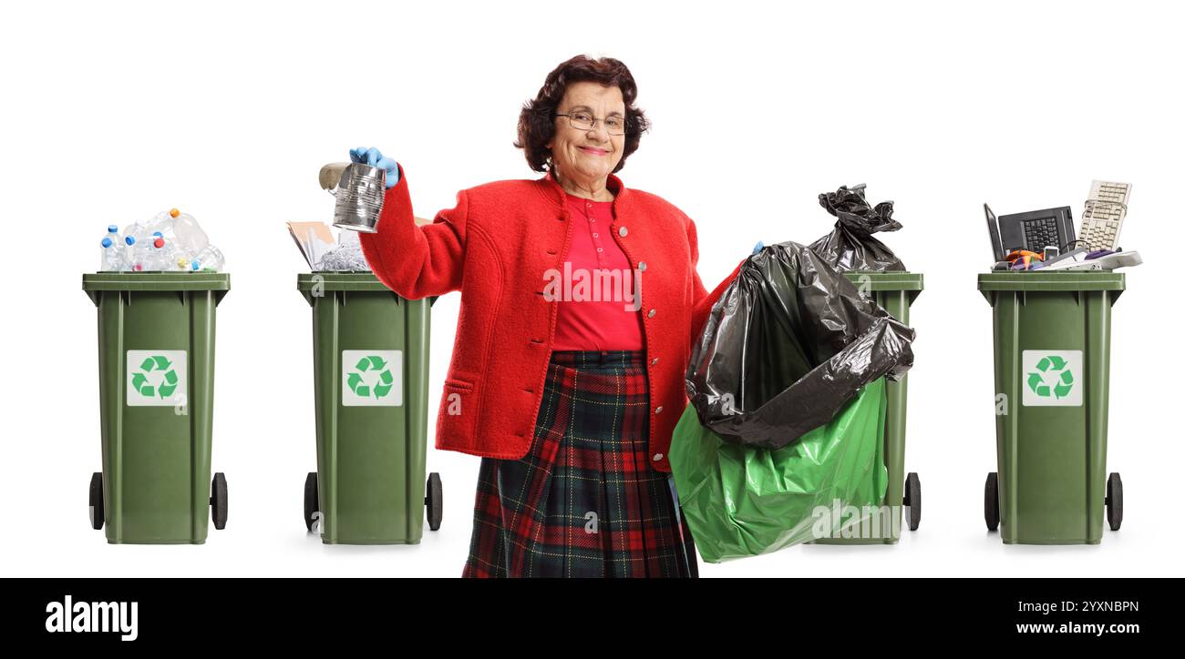 Elderly woman recycling tin cans and other materials isolated on white ...