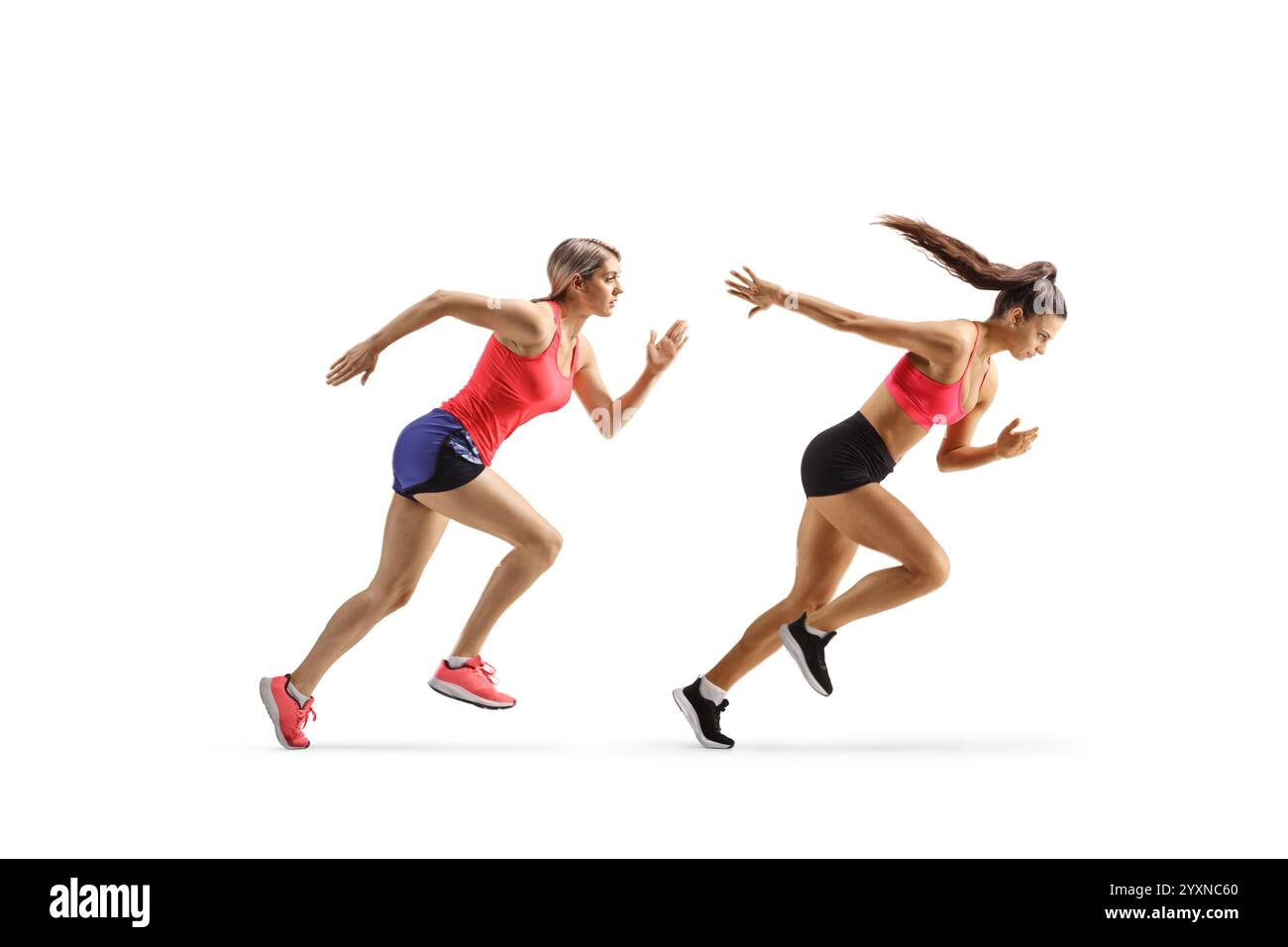 Two young women running isolated on white background Stock Photo - Alamy