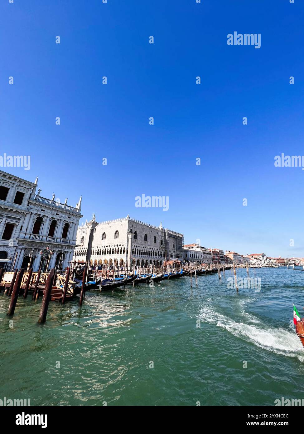 Beautiful view of historic buildings and gondolas along the Grand Canal ...