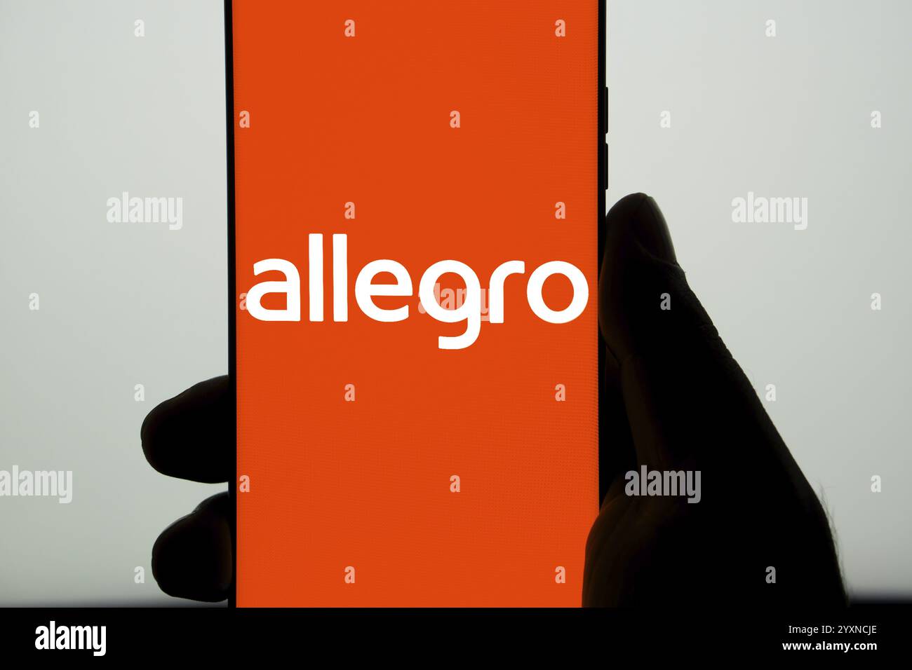 Dhaka, Bangladesh 14 Dec 2024:A close-up of a smartphone displaying the Allegro logo, an online ...