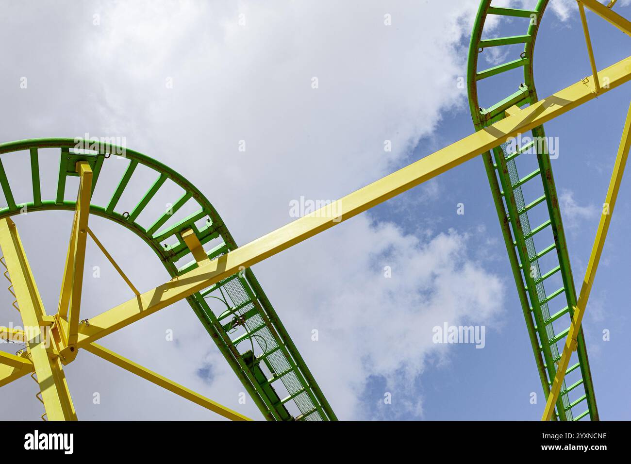 Roller coaster rails on cloudy sky background Stock Photo - Alamy