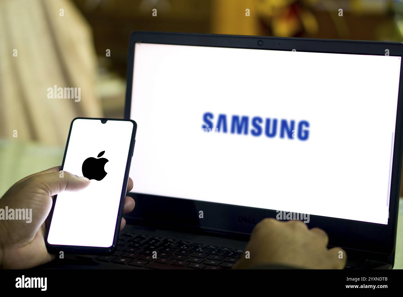 Apple vs Samsung logo on a smartphone Stock Photo - Alamy