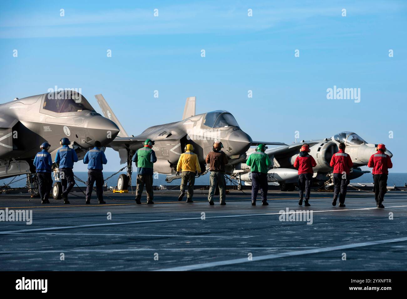 Italian Navy personnel on the deck of the ITS Cavour aircraft carrier ...