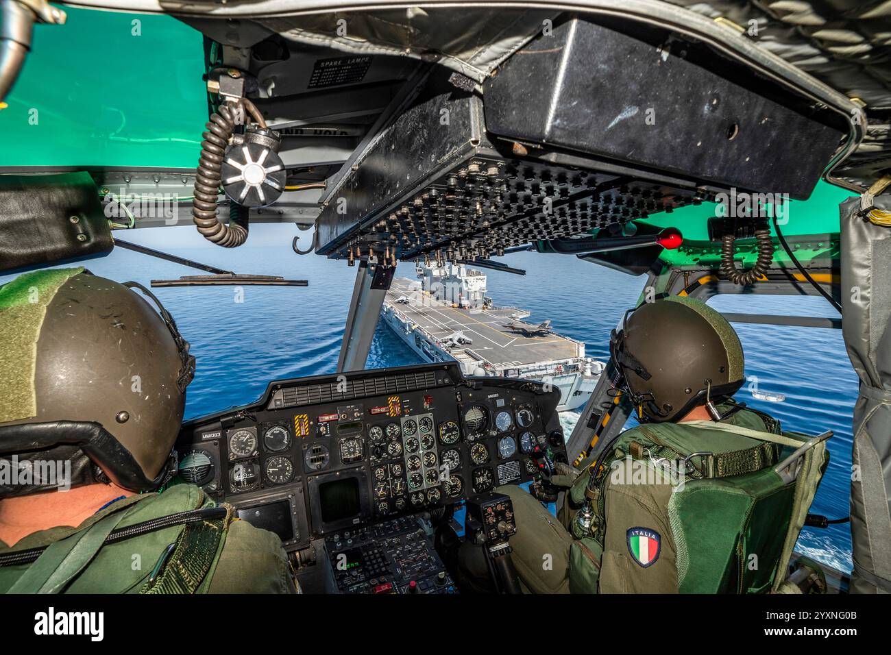 Italian Navy AB-212 ASW helicopter flying above the ITS Cavour aircraft ...