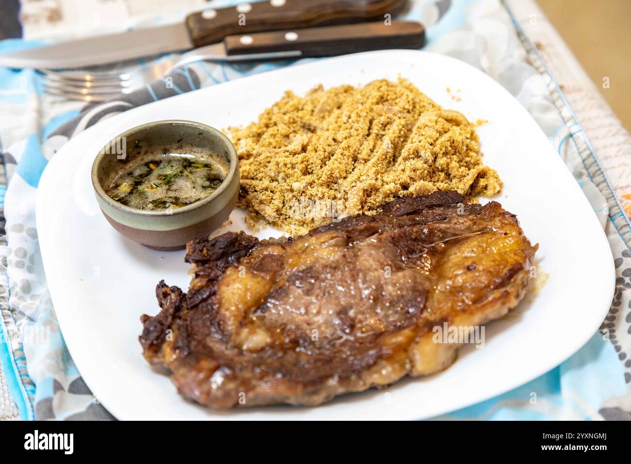 Typical Brazilian lunch with grilled steak, farofa and sauce Stock ...