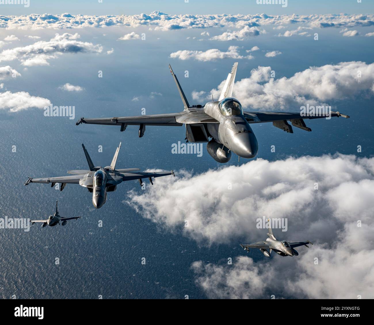 F/A-18 Super Hornets of the U.S. Navy and Hellenic Air Force F-16's fly ...