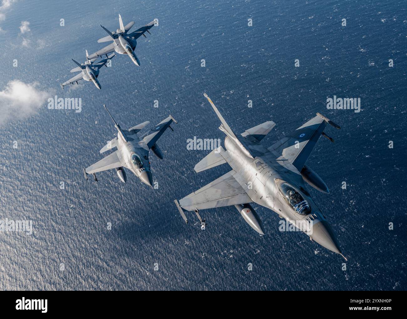 F/A-18 Super Hornets of the U.S. Navy and Hellenic Air Force F-16's fly ...