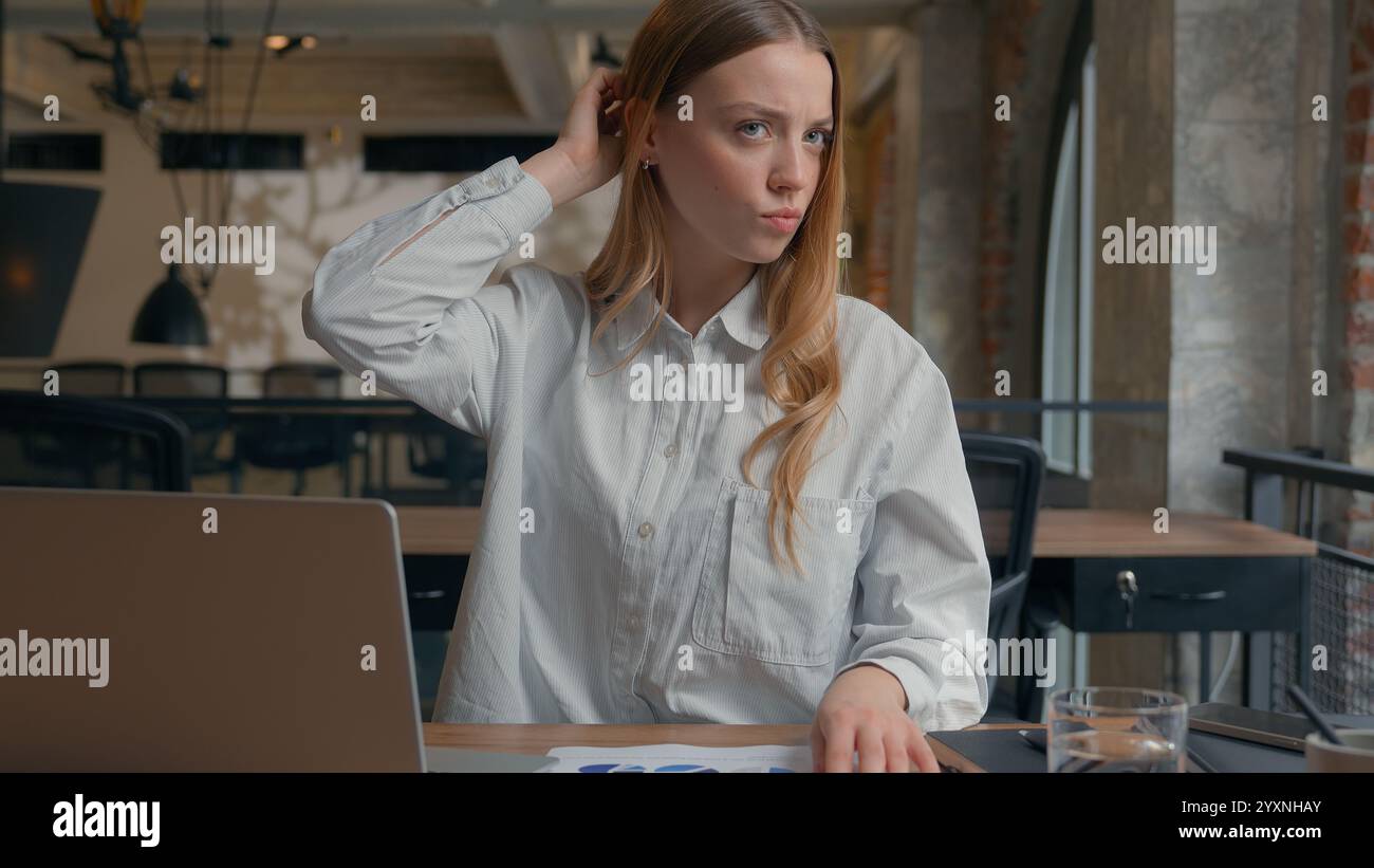 Business financial data work in office confused Caucasian girl analyze ...