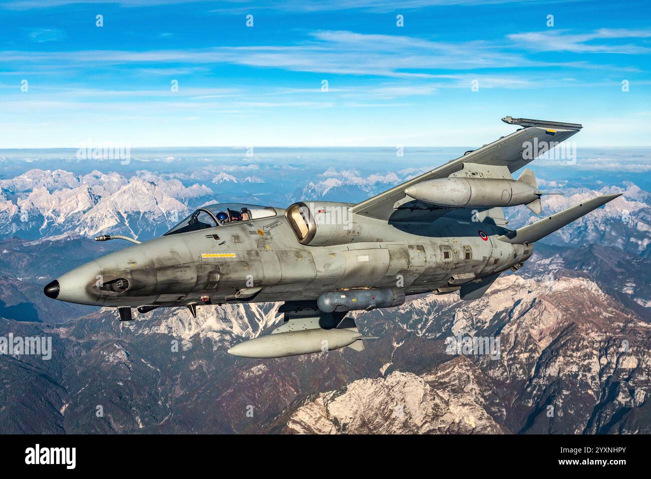 An Italian Air Force AMX Ghibli aircraft in flight over the Dolomites ...