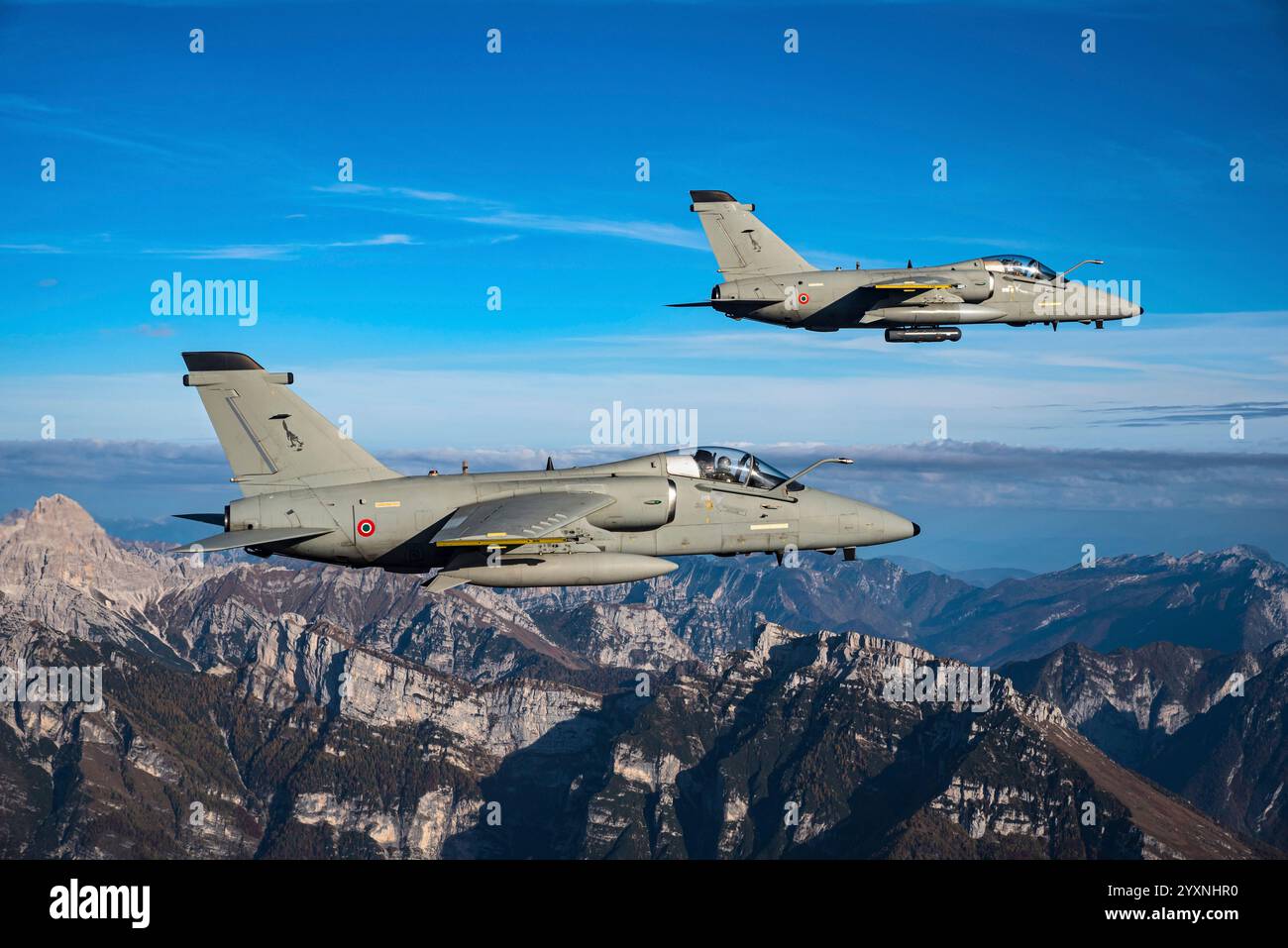 A pair of Italian Air Force AMX Ghibli aircraft flying over the high ...