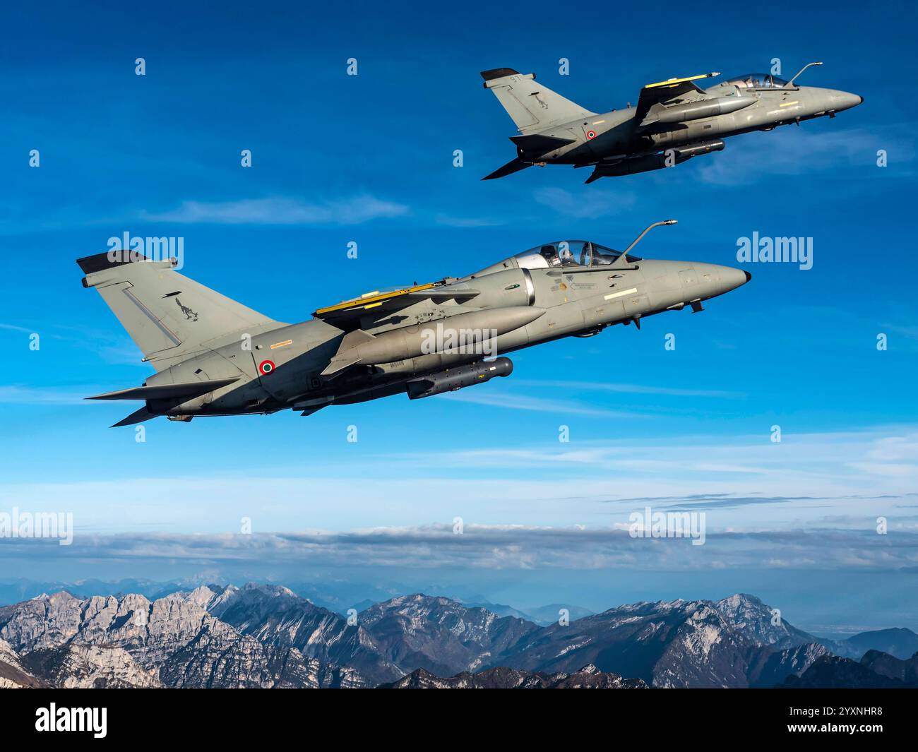 A pair of Italian Air Force AMX Ghibli aircraft flying over the high ...
