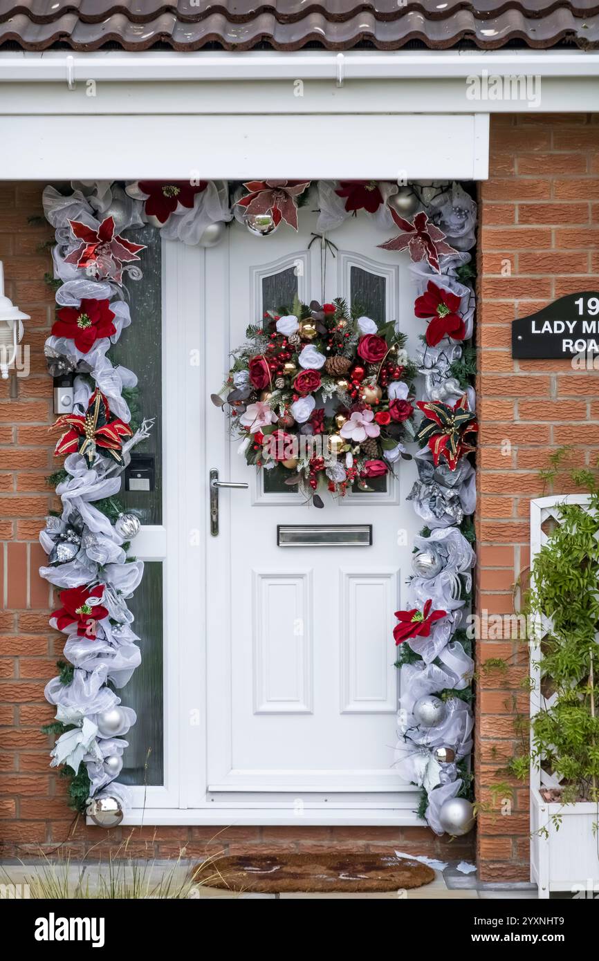 Luxury Christmas wreath on front door with door surround dressing Stock ...