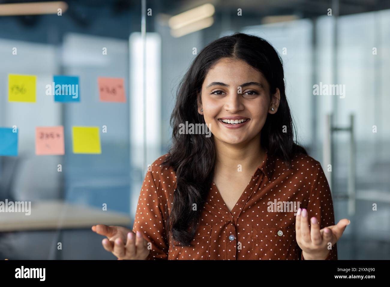 Professional individual expressing confidence and approachability in a ...