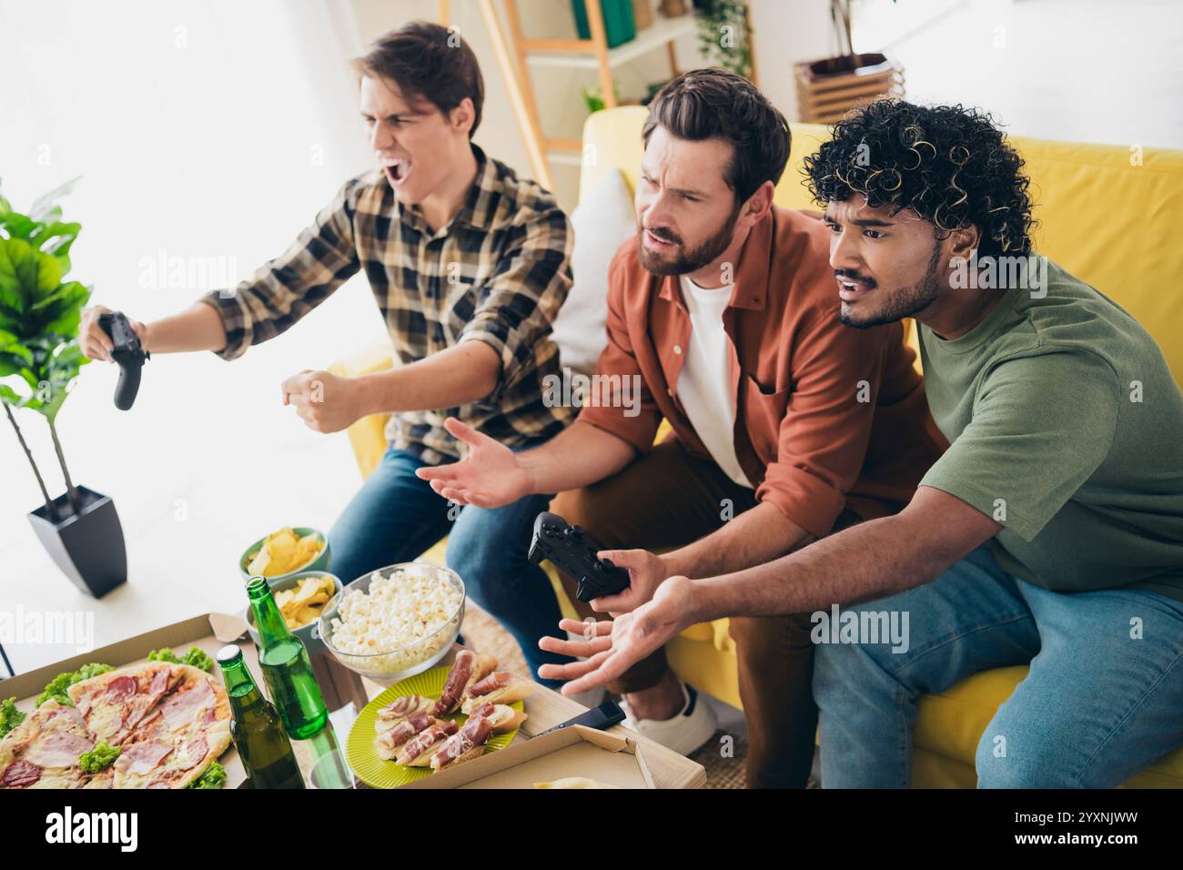 Photo of company three friends video game tournament hang out weekend ...