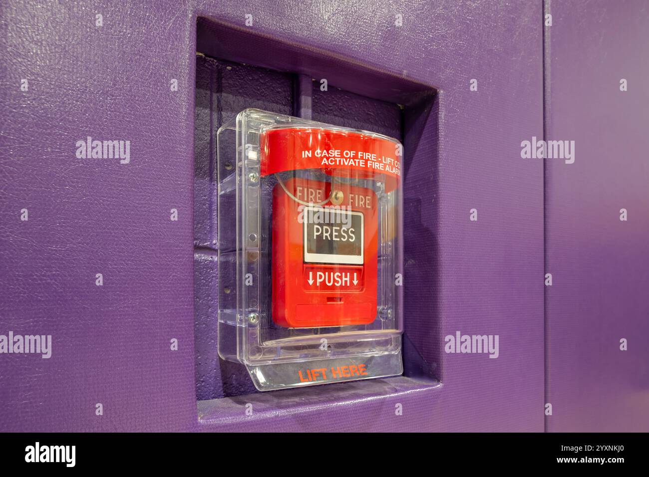 Red fire alarm system pull station under a protective clear plastic ...