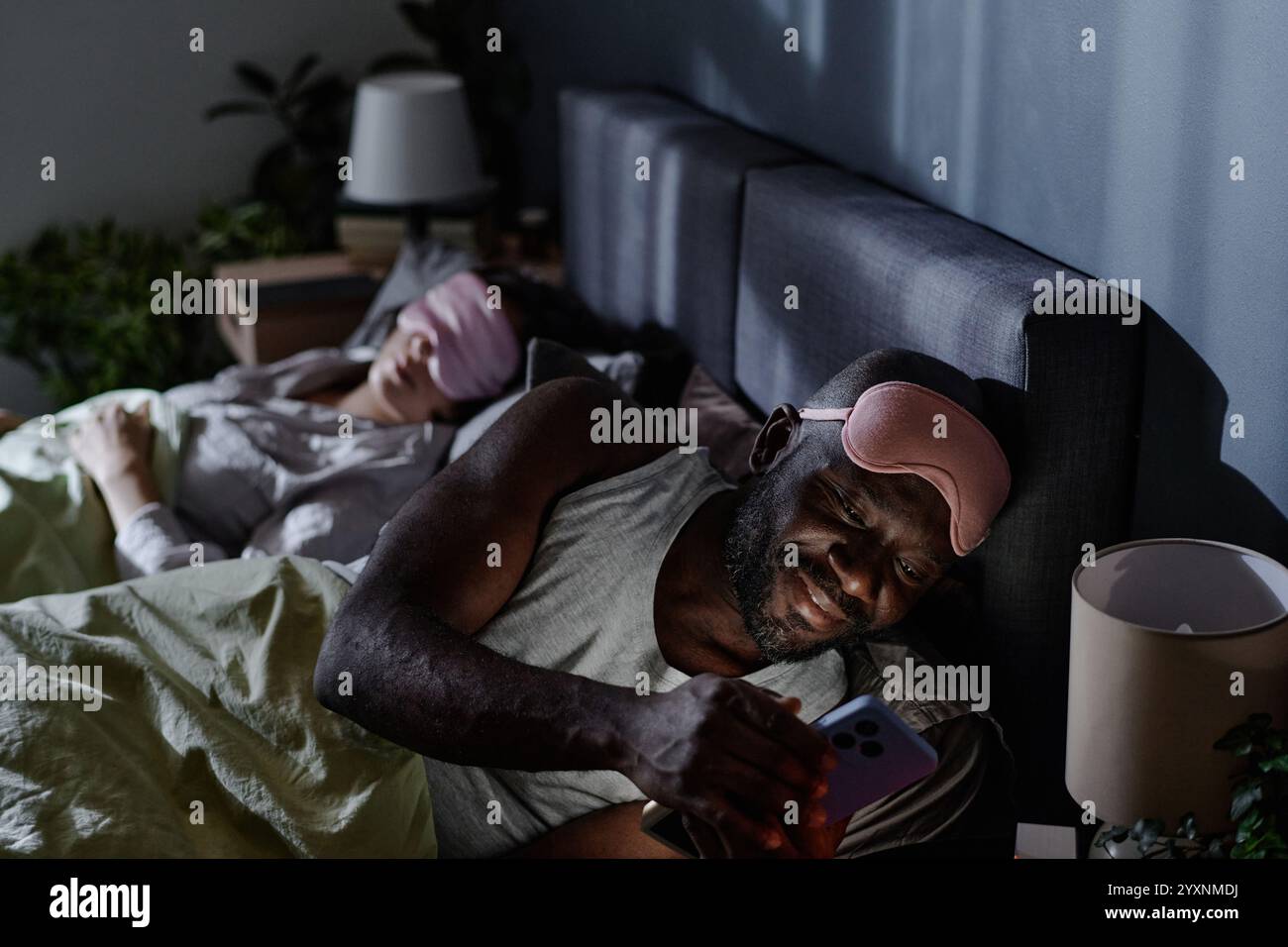 High angle shot of African American man chatting on social network ...