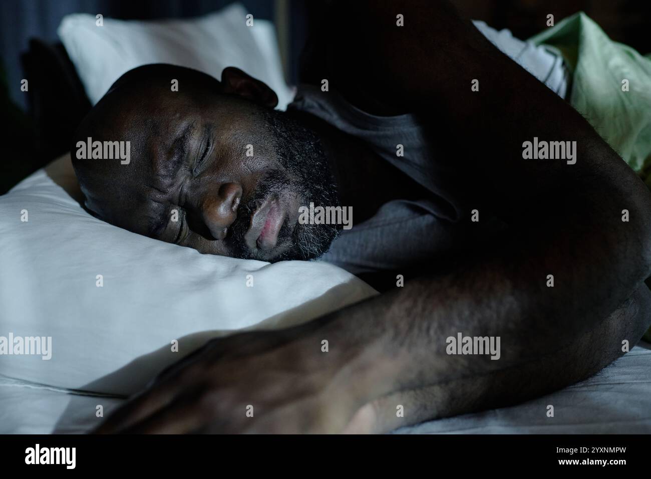 Medium close up of African American suffering from nightmare while ...