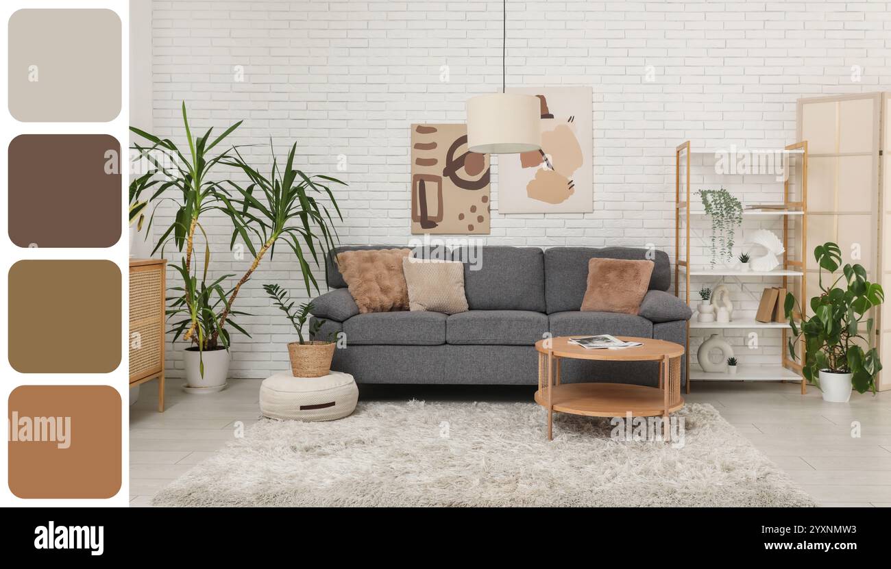 Interior of living room with comfortable grey sofa and table. Different ...