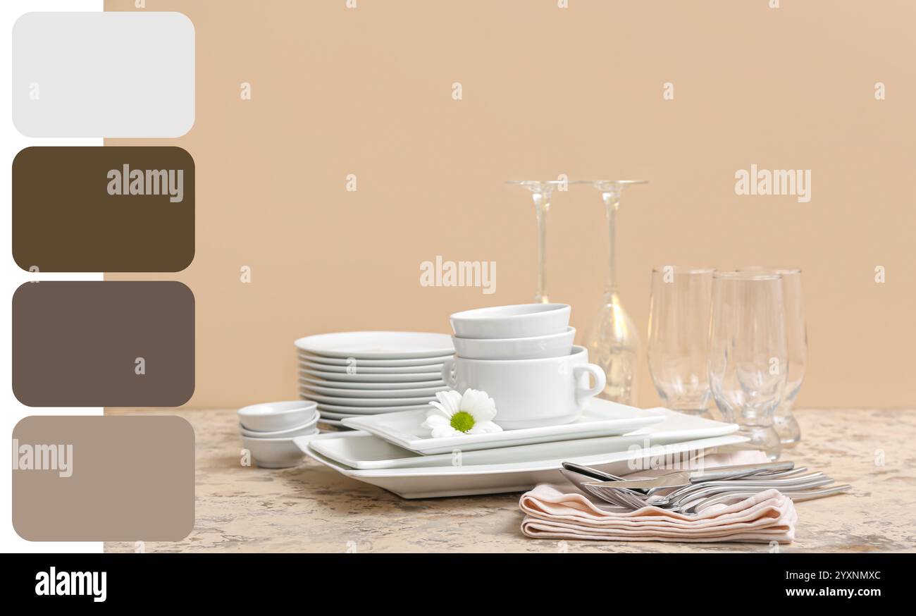 Clean dishes, glasses and cutlery on table. Different color patterns ...