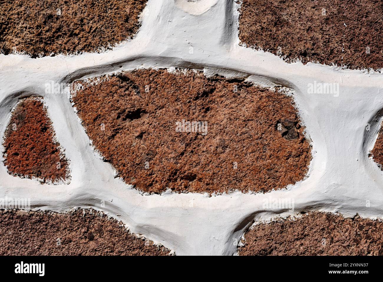 A brick wall with a white border and a brown brick in the middle. The ...
