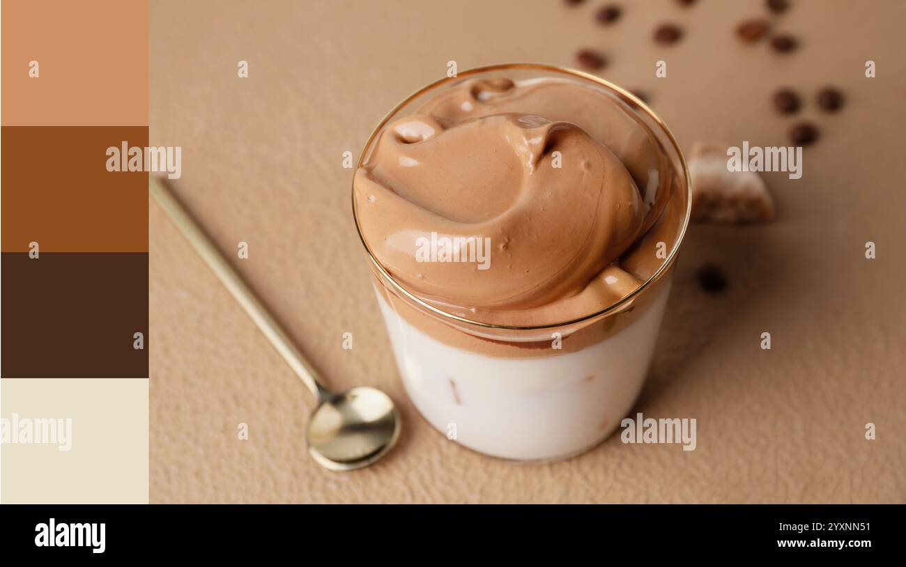 Glass of tasty dalgona coffee on beige background. Different color ...