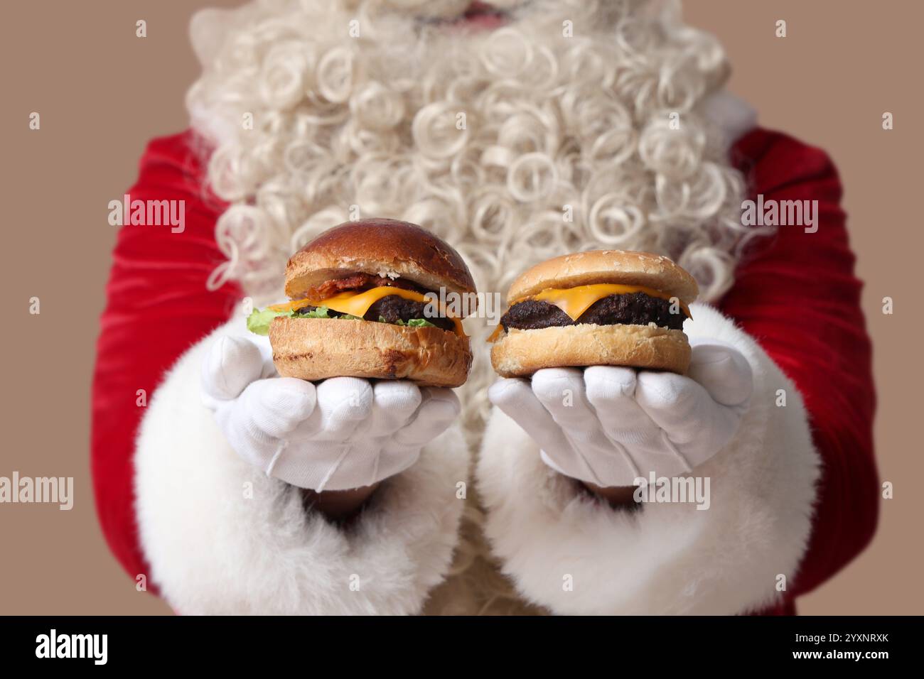 Santa Claus with tasty burgers on beige background, closeup Stock Photo ...
