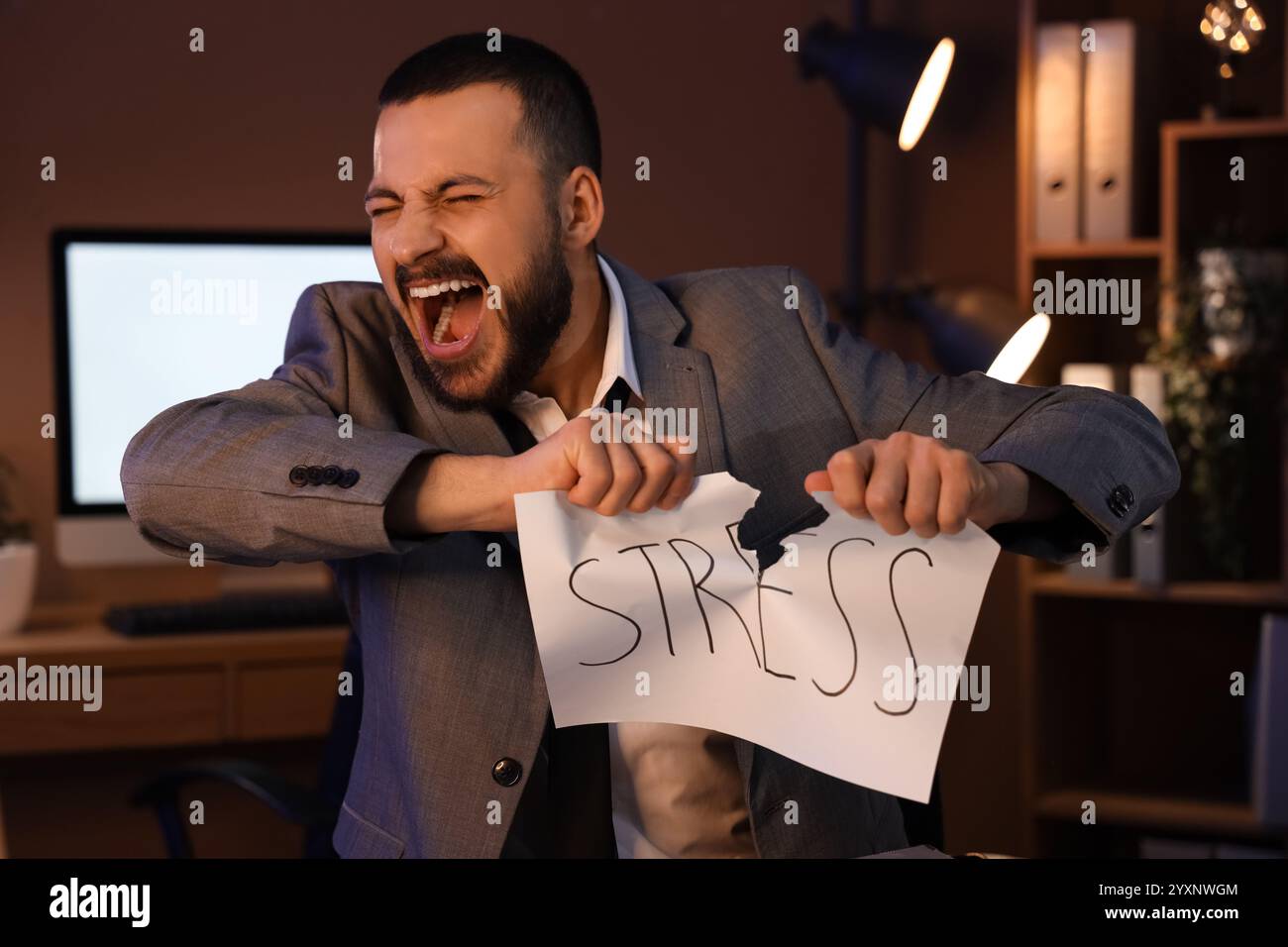 Angry businessman tearing paper hi-res stock photography and images - Alamy