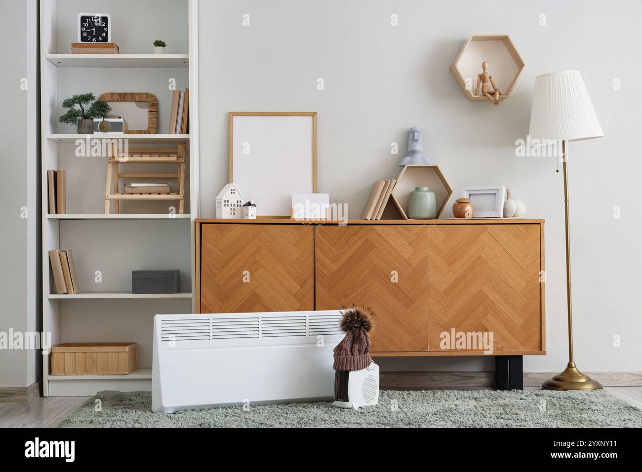 Interior of stylish living room with modern electric heaters and wooden ...