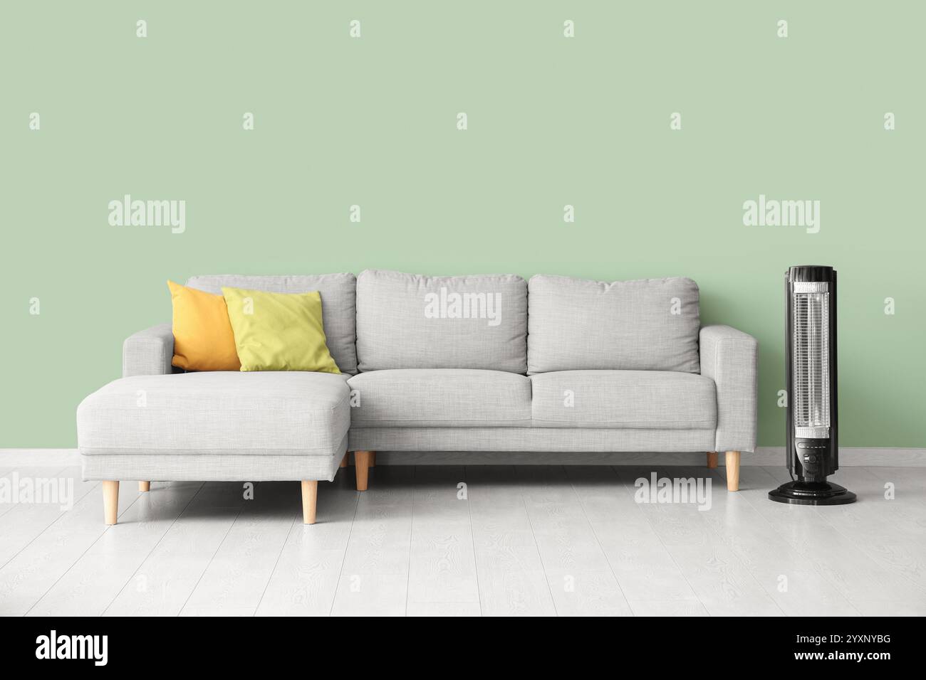 Interior of stylish living room with modern electric heater and grey ...